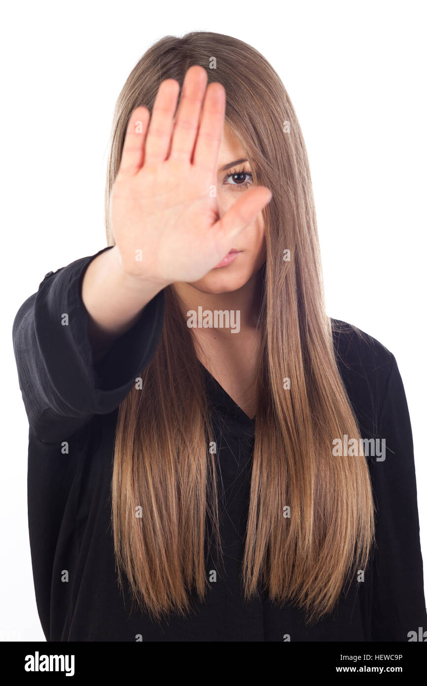 Pretty young girl making stop sign isolated on a white background Stock ...