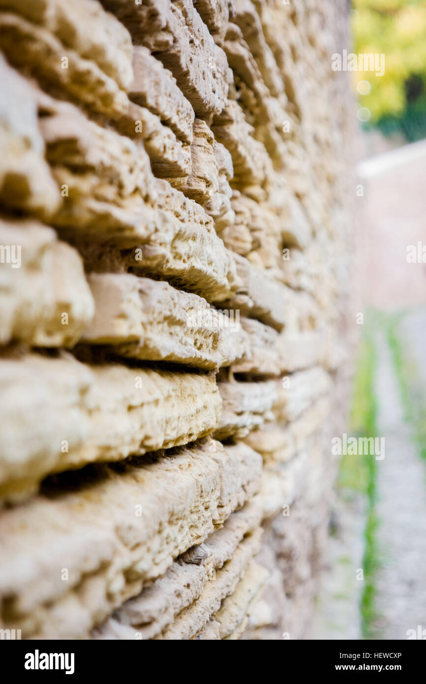 Detail of an ancient eroded stone wall Stock Photo - Alamy