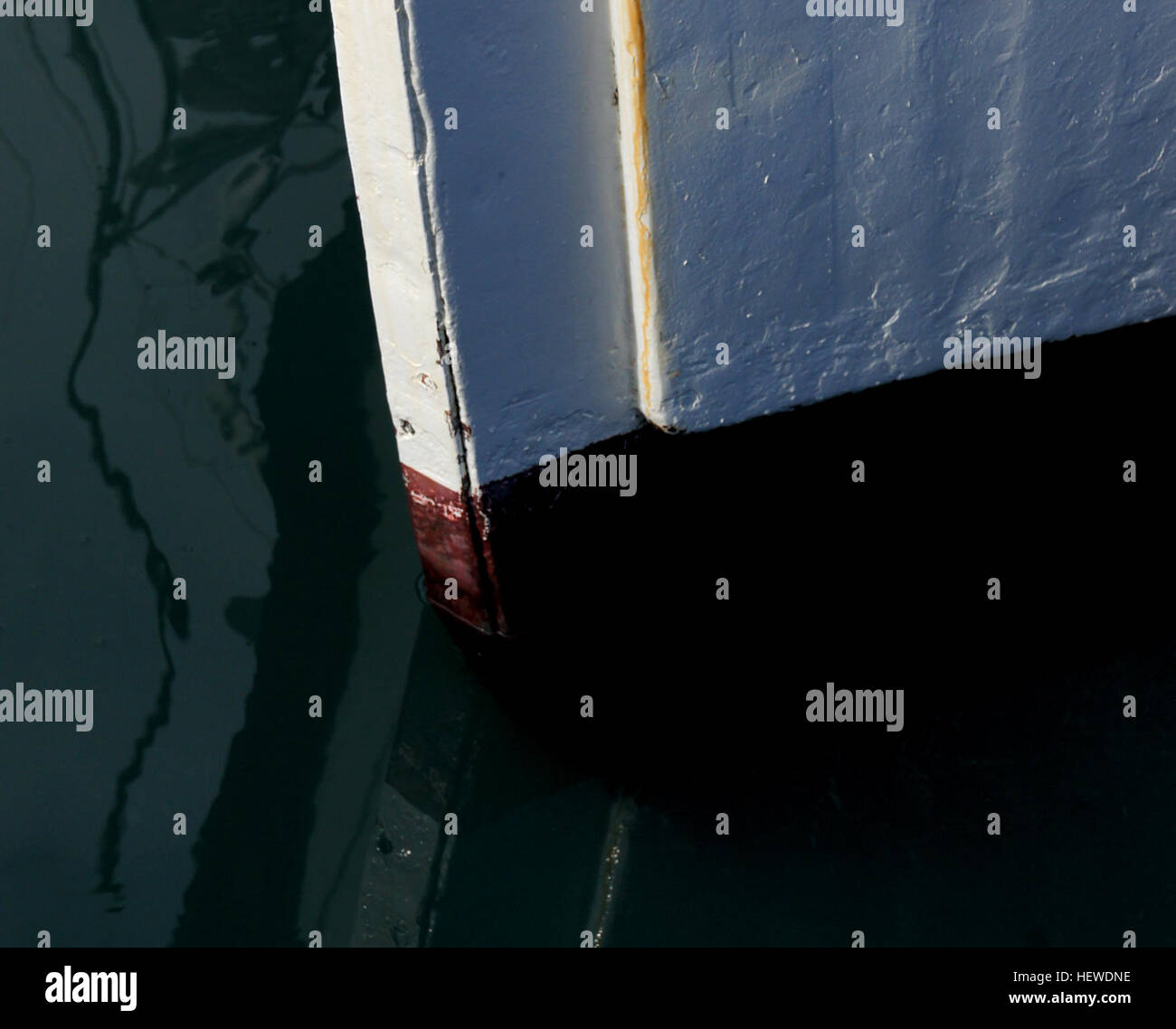 This image showcases fishing boats, with emphasis on their prows, which ...