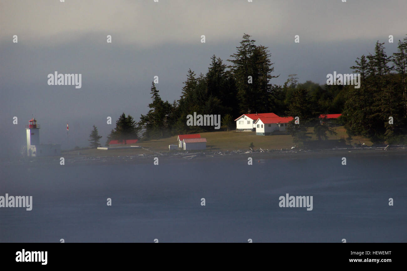 This photograph depicts a lighthouse along the Inside Passage in Alaska ...