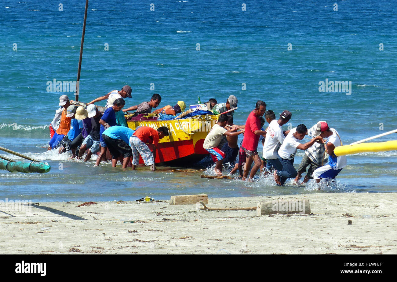 This image captures fishermen working together in Luzon, utilizing ...
