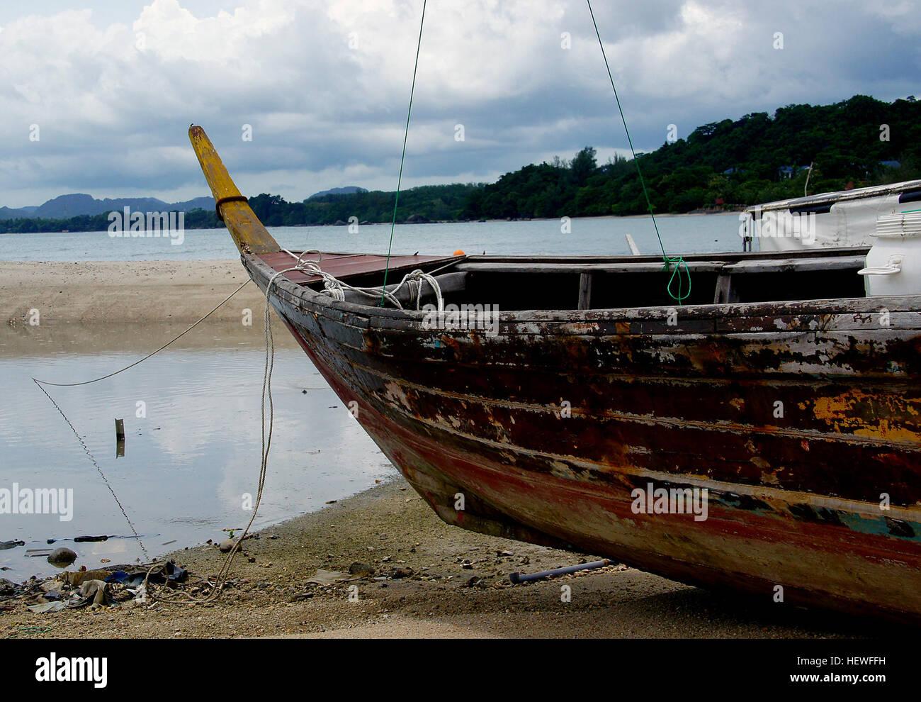 This photograph captures the vibrant scene of fishing boats in Malaysia ...