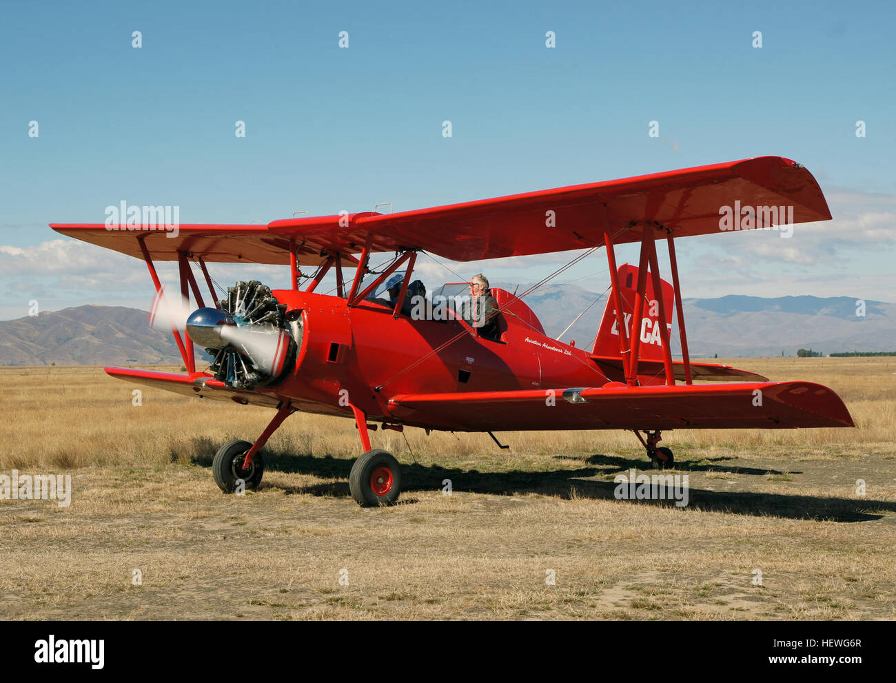 A red Grumman Ag-Cat biplane, powered by a radial engine, is seen at ...