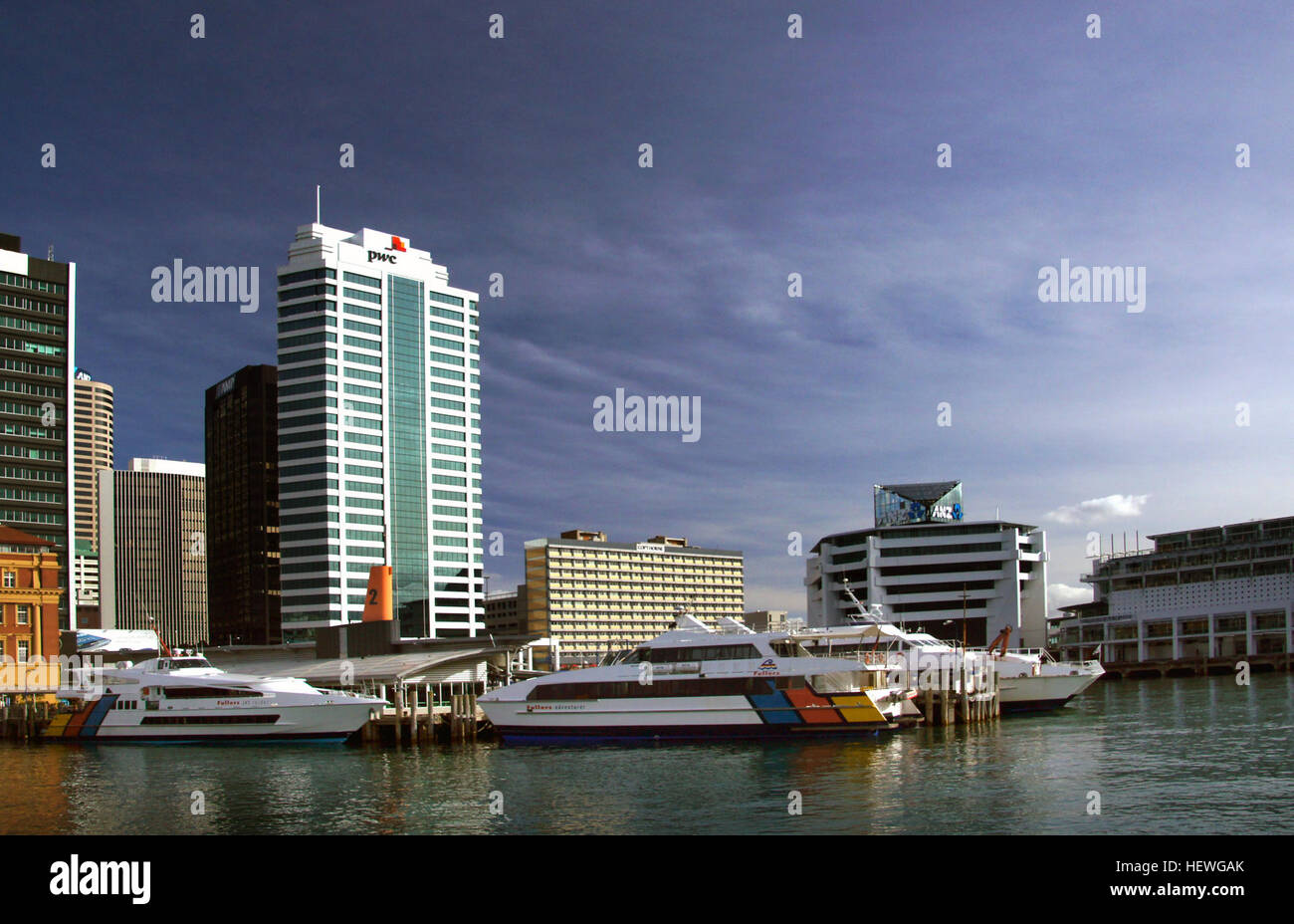 A photograph showcasing the Auckland Ferry Building, with ferries ...
