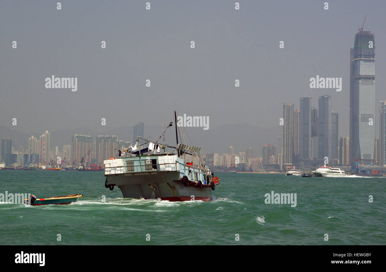 A view of Hong Kong Harbour, showcasing boats and the city's dynamic ...