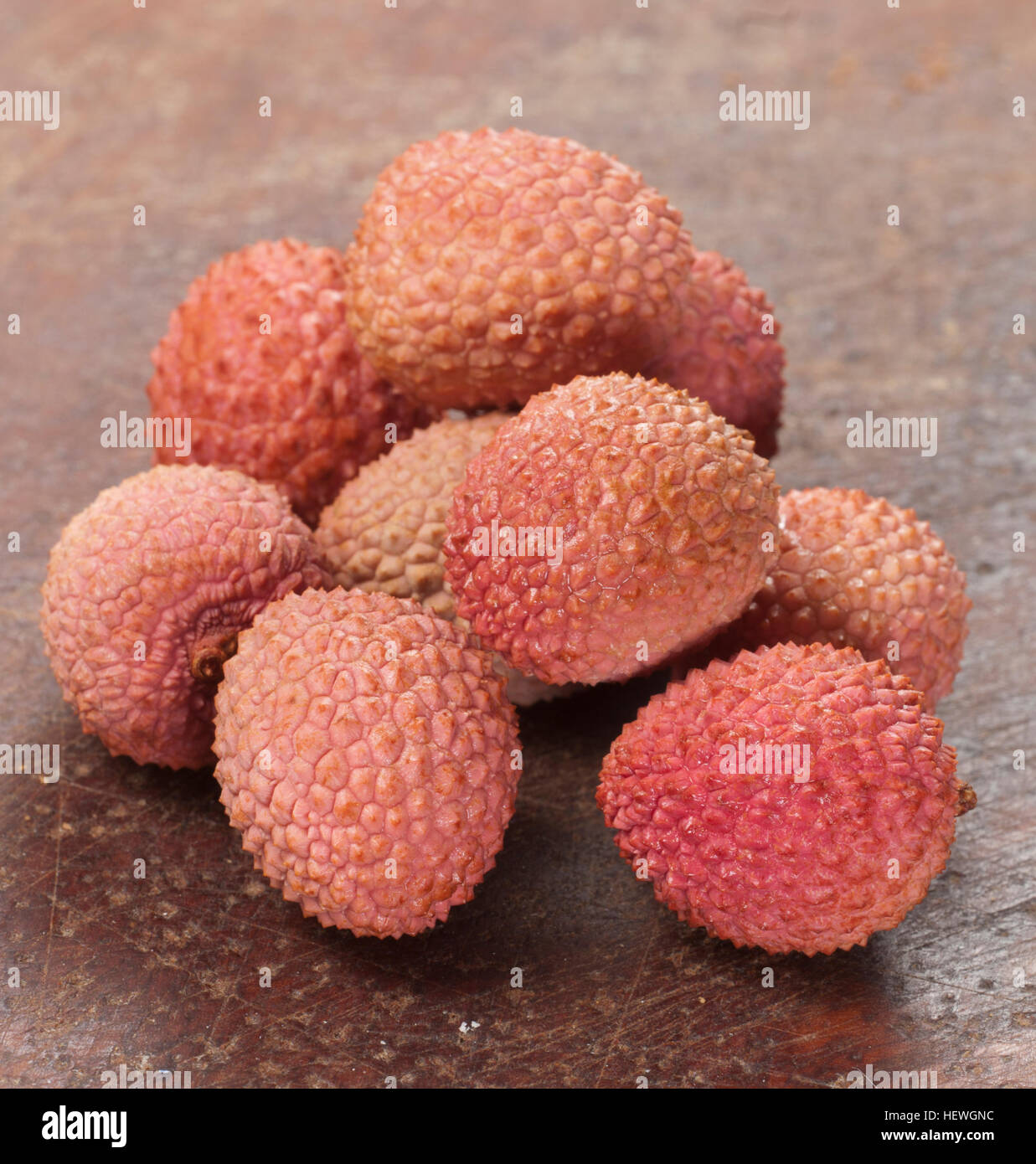 Lychee berries on a timber board, close up Stock Photo - Alamy