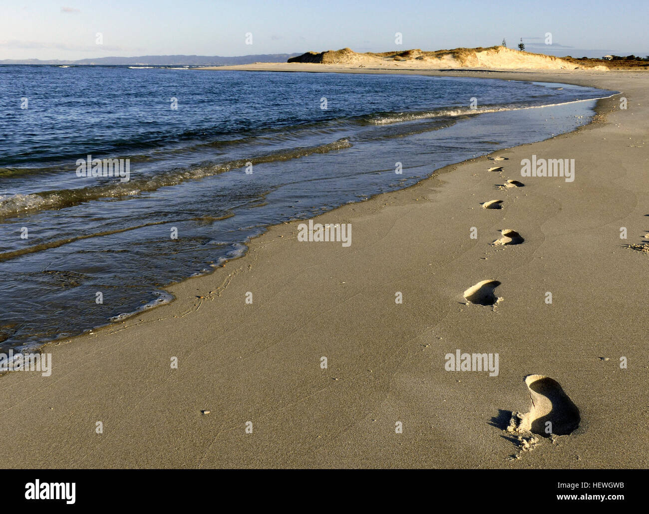 A beach scene captured with a bridge camera, featuring footprints in ...