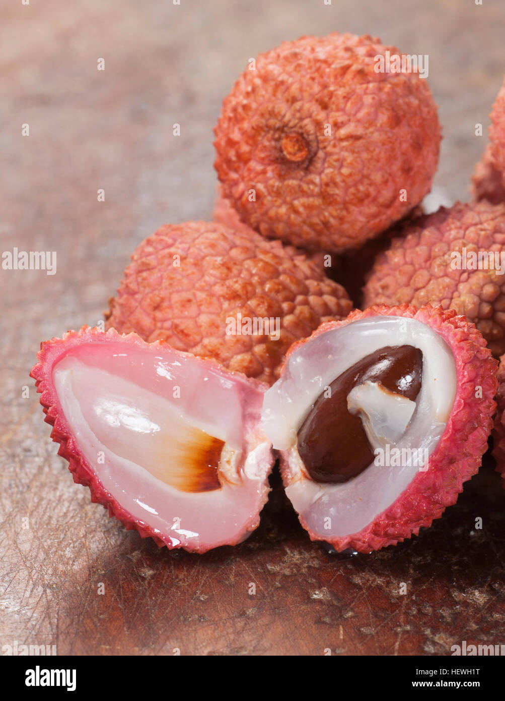 Lychee berries on a timber board, close up Stock Photo - Alamy