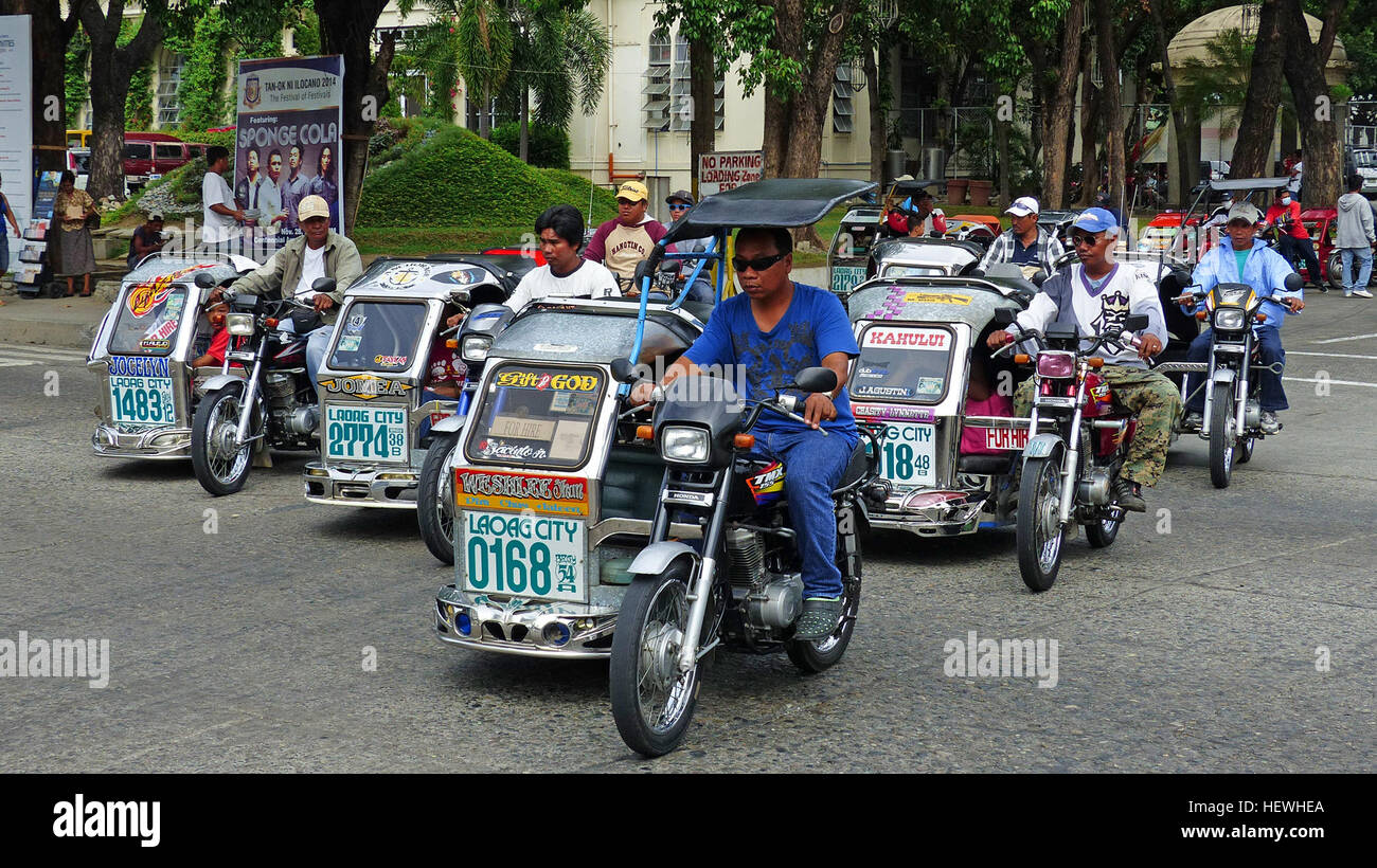 Motorized tricycles, a popular form of auto-rickshaw in the Philippines ...