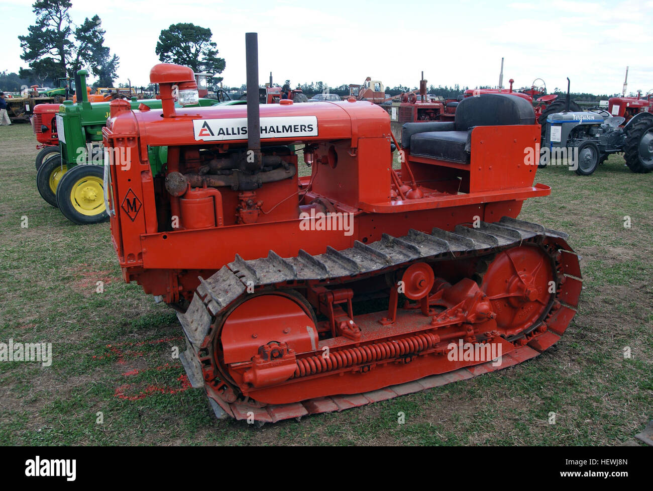 This image captures farm equipment, including Allis Chambers tractors ...