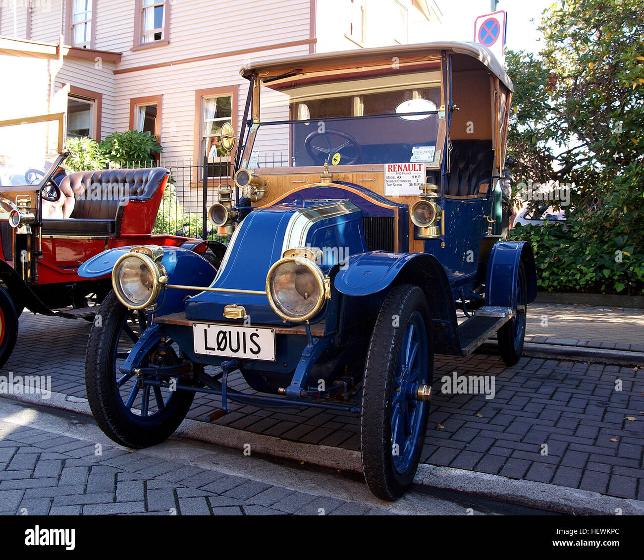 This photograph highlights a 1912 Renault 2-cylinder 9 HP blue car ...