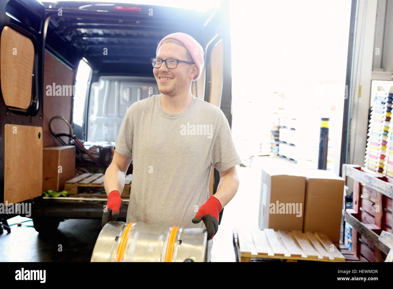 Worker in brewery, preparing to distribute barrels of beer Stock Photo ...