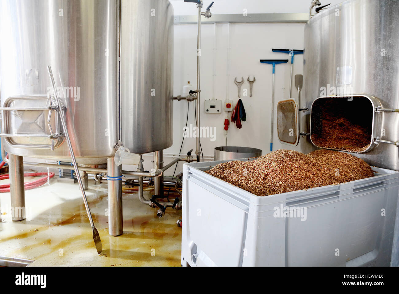 Spent grains from mash tun in large container Stock Photo - Alamy