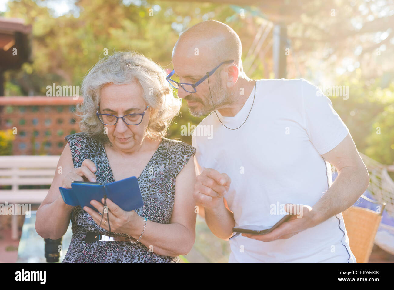 Senior man woman smartphones hi-res stock photography and images - Alamy