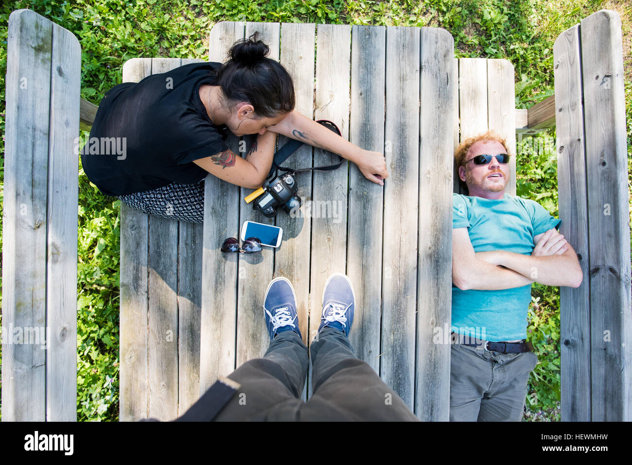 Overhead point of view shot of couple resting on picnic bench Stock ...