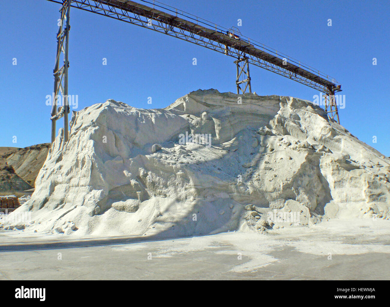 This historical image showcases the salt harvesting process at the ...