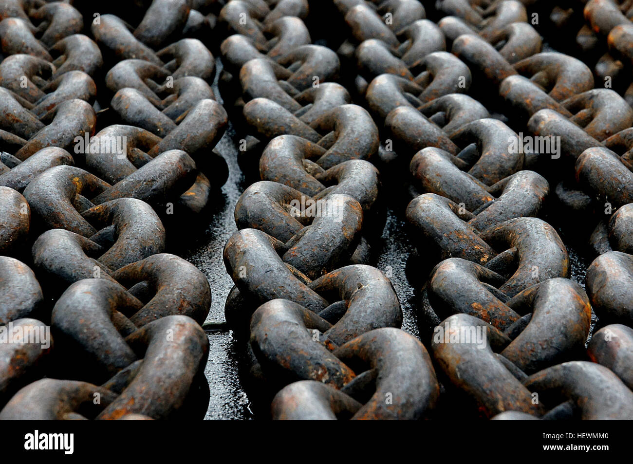 A chain consists of interconnected metal links, commonly used for ...