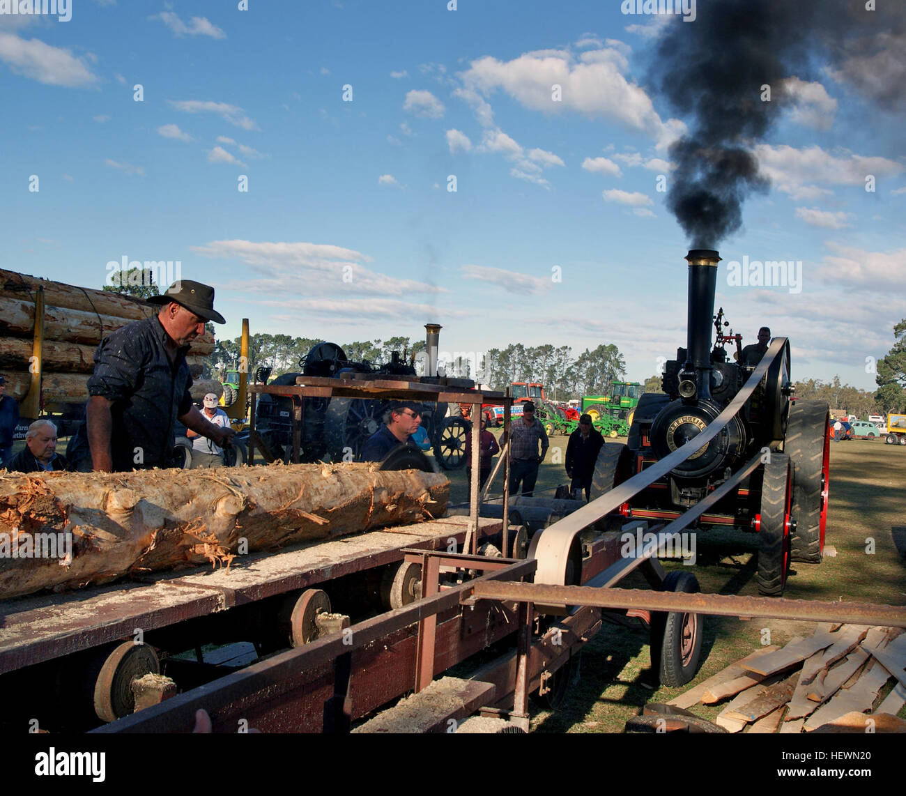 This photograph captures a steam-driven engine at a timber traction ...