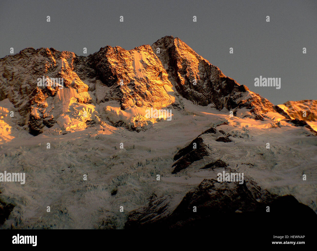 Mount Sefton towers almost 2000 metres above Mount Cook village. It is ...
