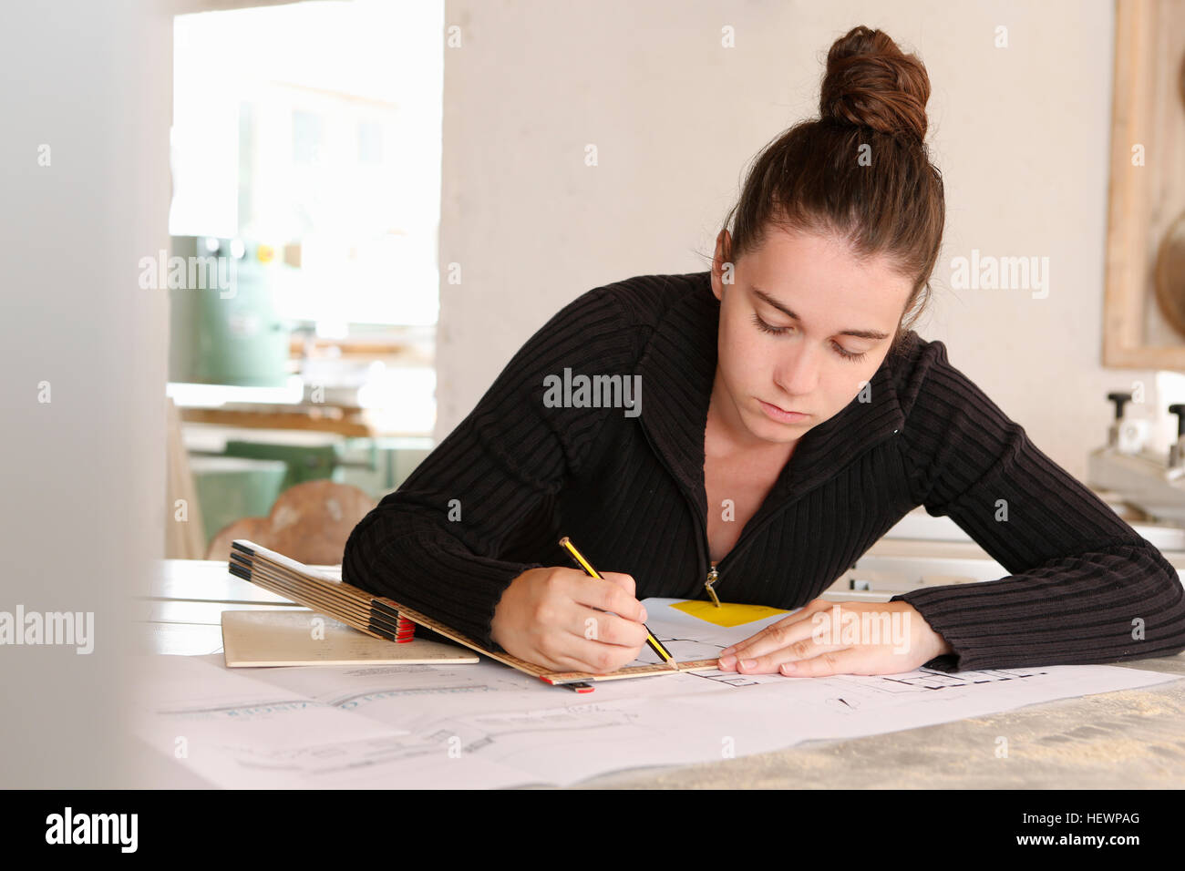 Woman drawing blueprint Stock Photo - Alamy