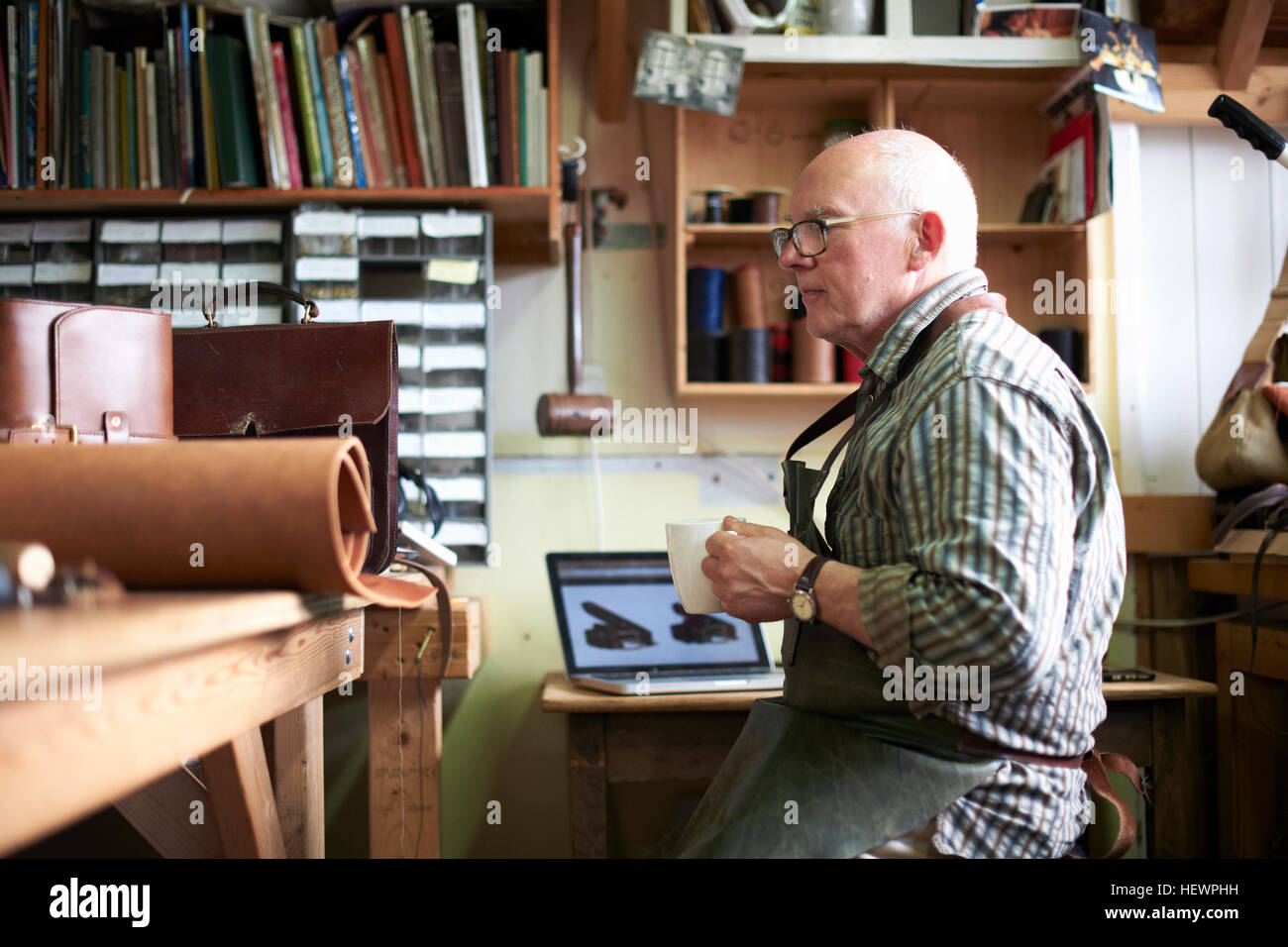 Male worker in leather workshop Stock Photo - Alamy