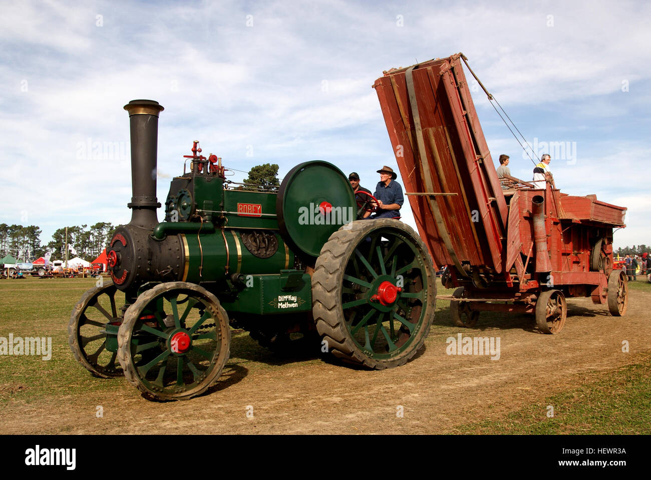 A Robey Traction Engine is showcased in a vintage farming scene ...
