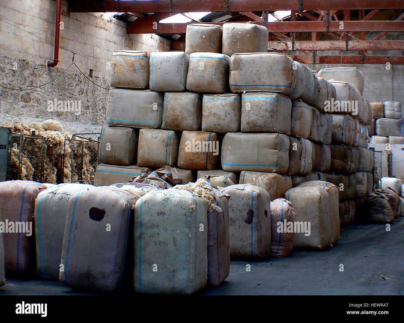 This image depicts sheep farming practices with a wool store where wool ...