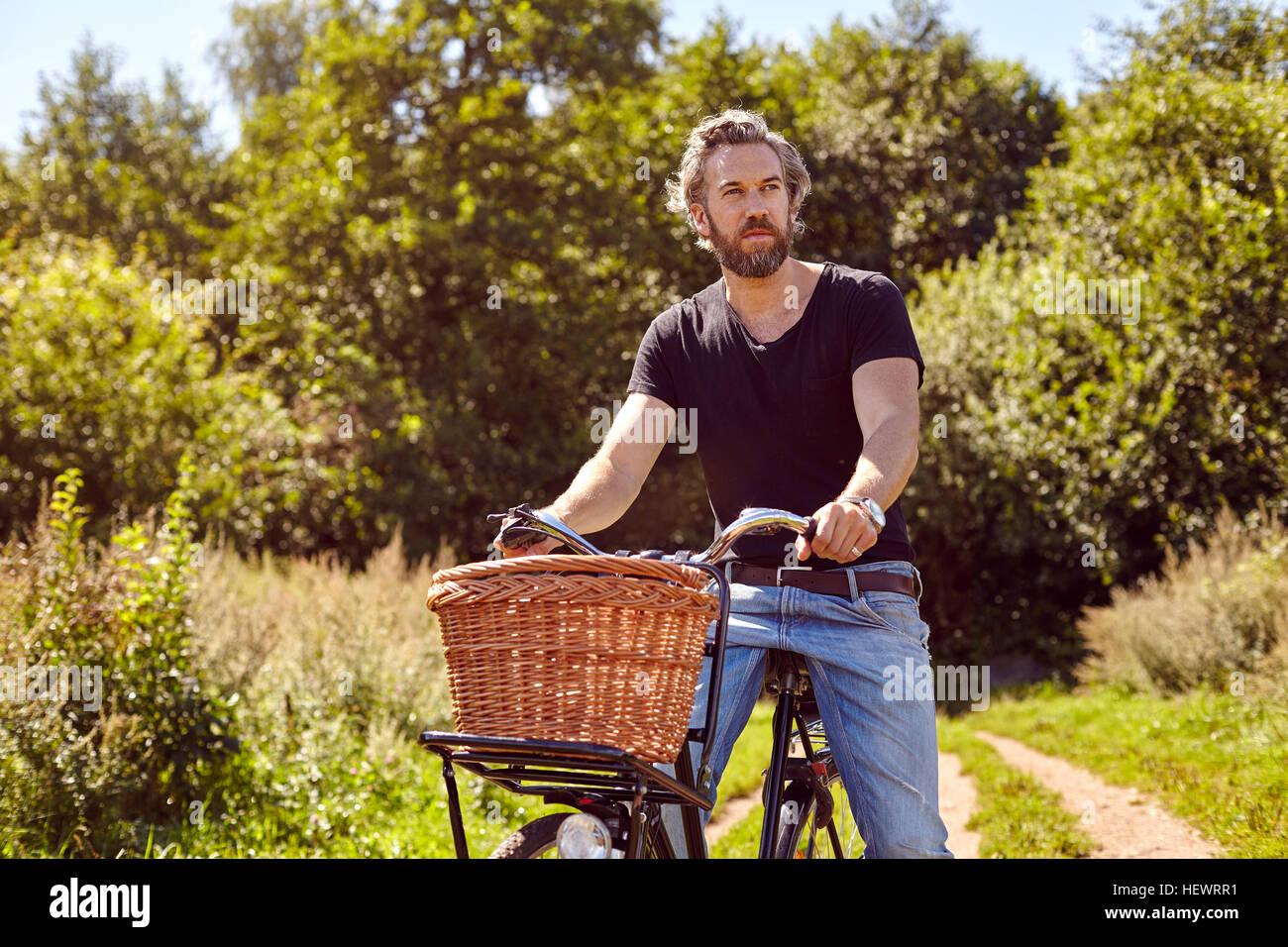 Adult man bicycle sitting hi-res stock photography and images - Alamy