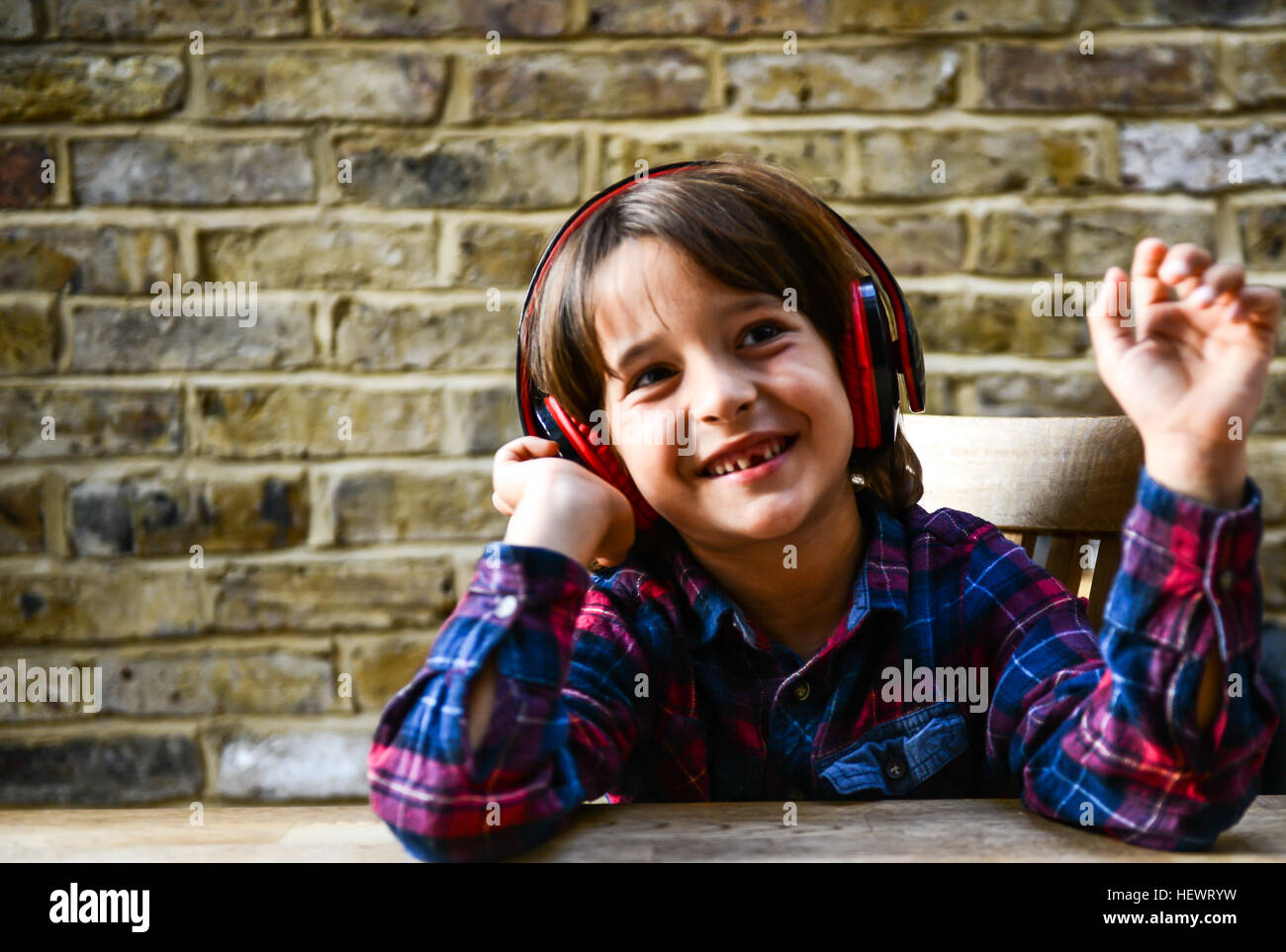 Boy listening with headphones hi-res stock photography and images - Alamy