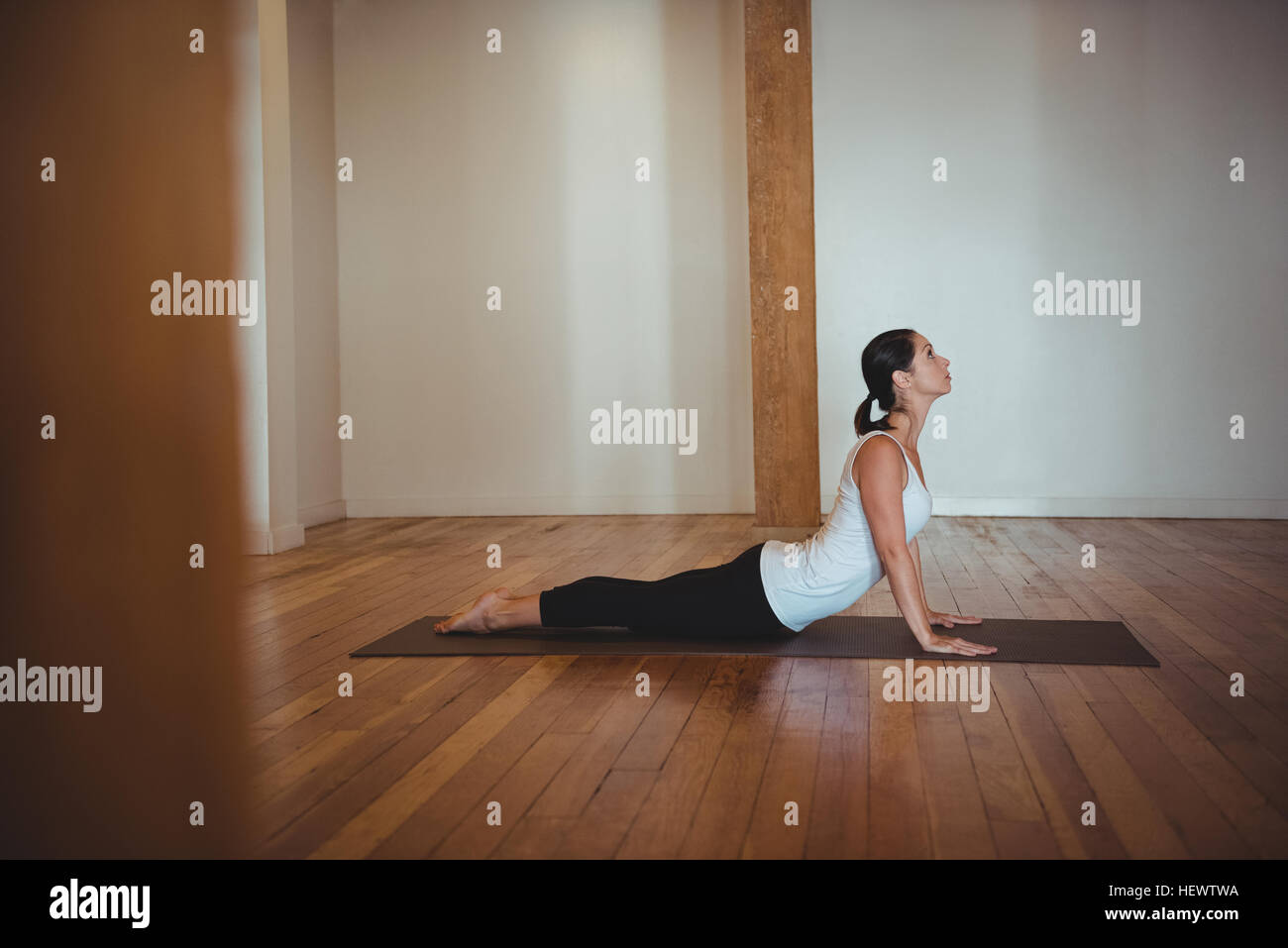 Woman practising cobra pose hi-res stock photography and images - Alamy
