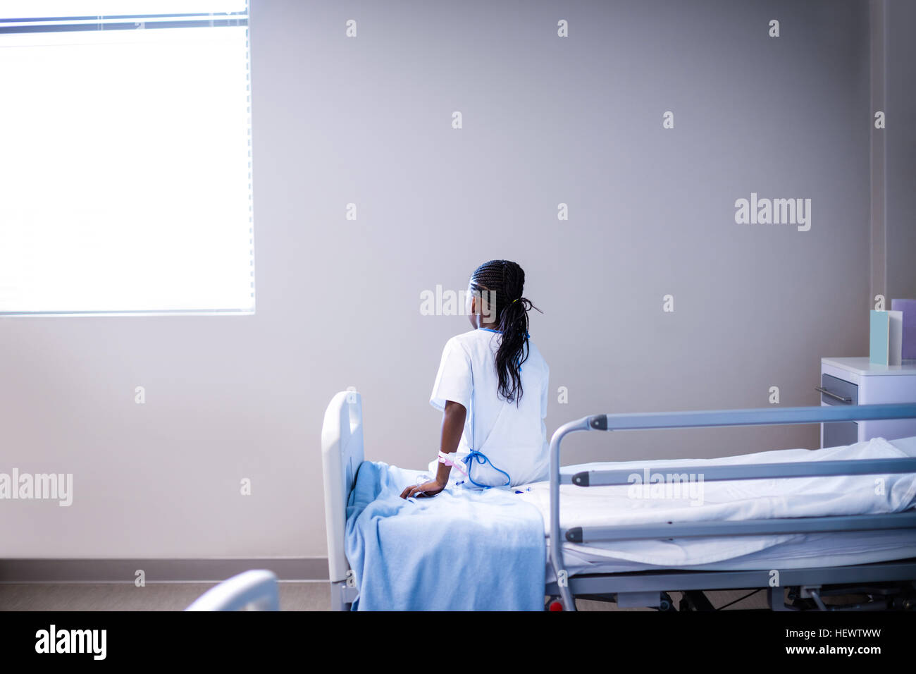 Patient sitting on the bed at hospital Stock Photo - Alamy