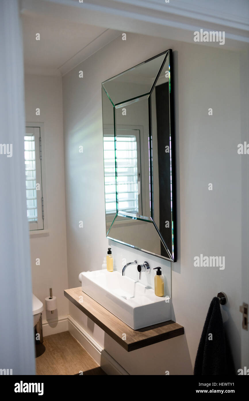 Empty bathroom with hand wash basin at home Stock Photo - Alamy