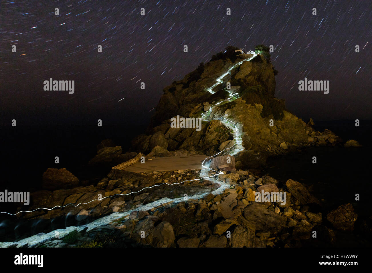 A path of light to the top of the hill at night Stock Photo - Alamy