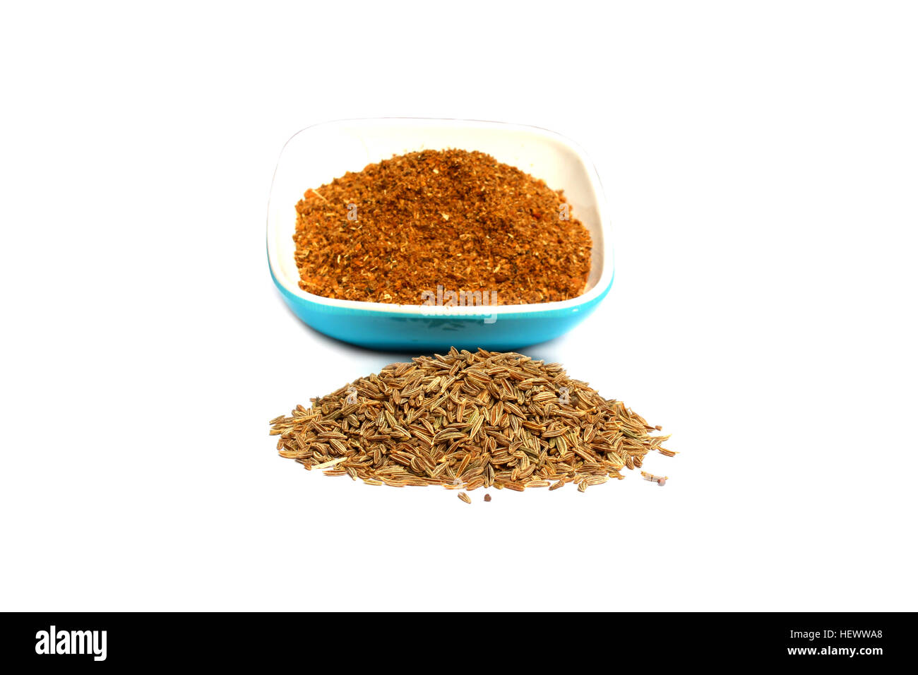Cumin and cumin powder over white background Stock Photo - Alamy