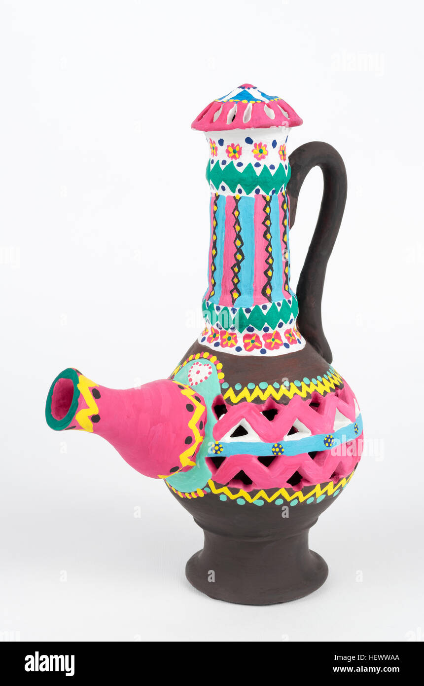 Front view of Nubian style decorated colorful handcrafted pottery jug ...