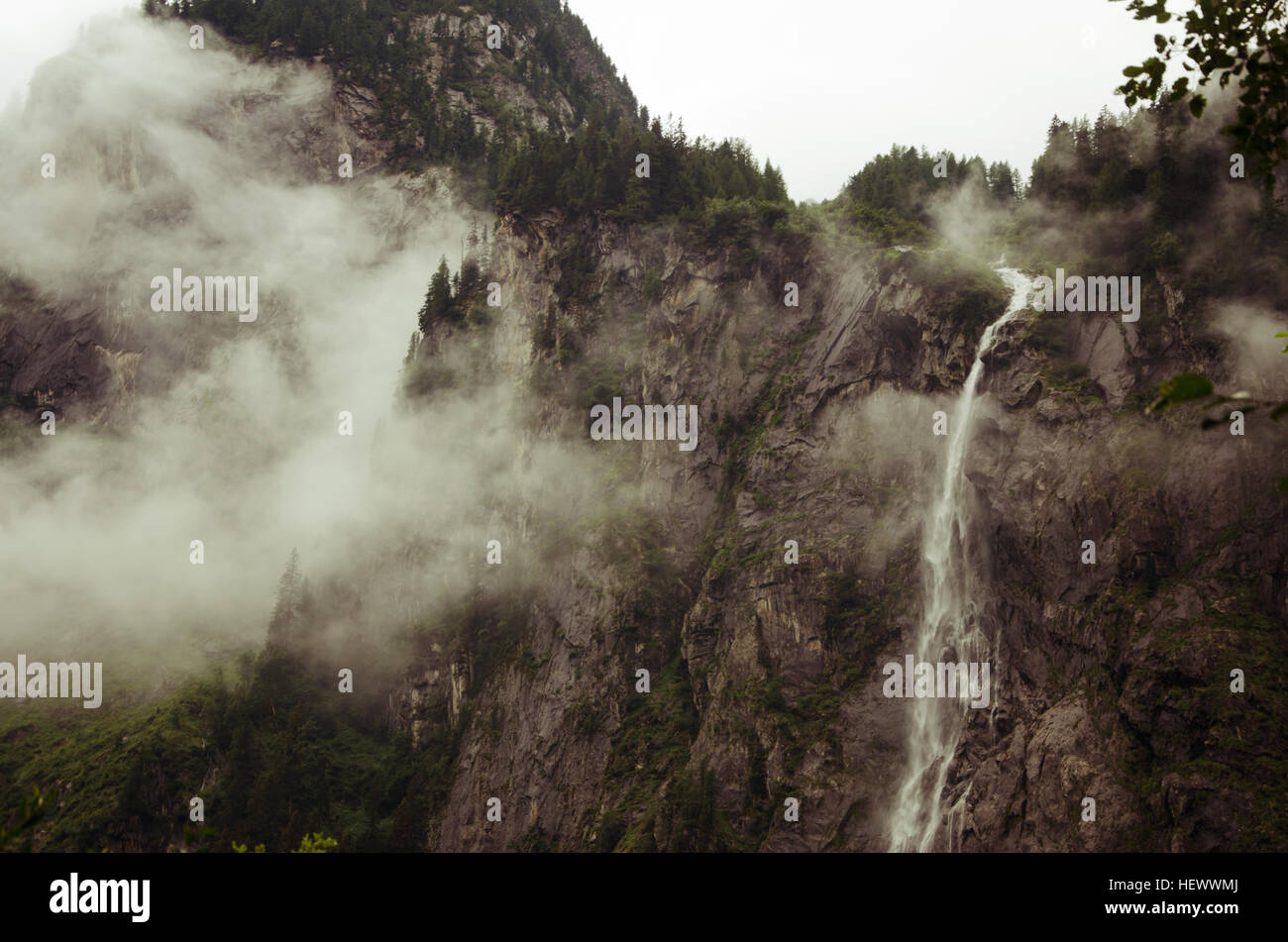 Waterfall in fog Stock Photo - Alamy