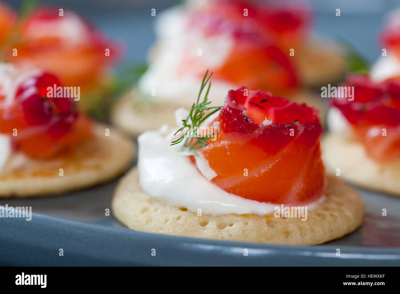 Party blinis with beetroot cured salmon, cream and horseradish Stock ...
