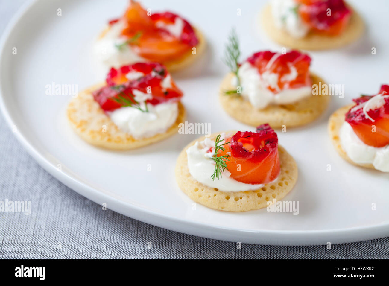 Party blinis with beetroot cured salmon, cream and horseradish Stock ...