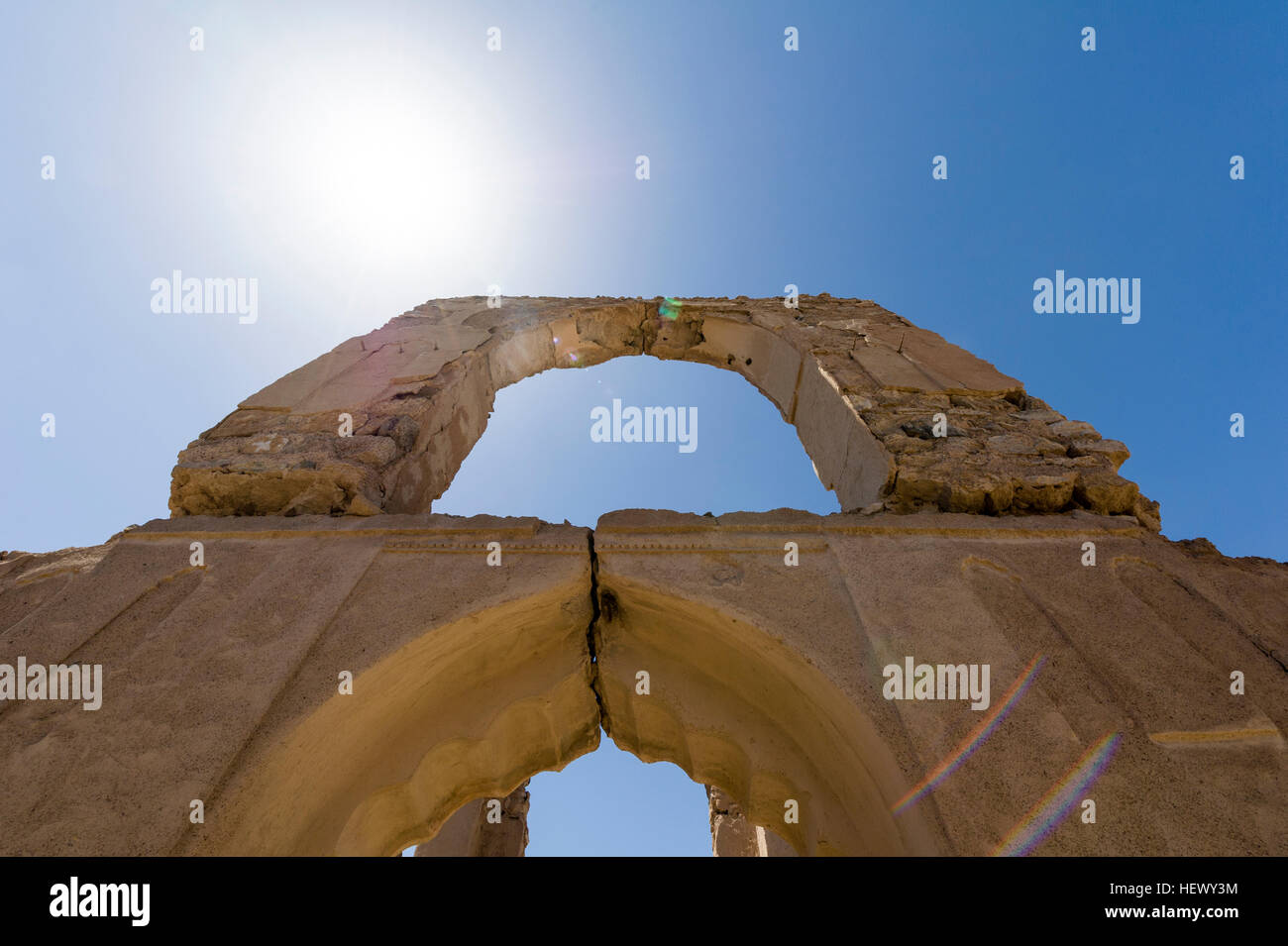 Stone and mud brick archways in an abandoned village in the desert ...