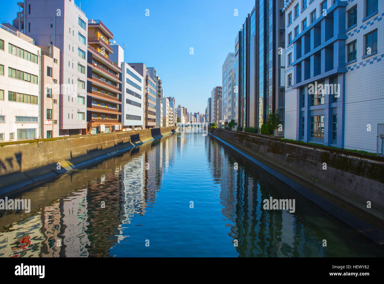 The canal in Tokyo city with office building Stock Photo - Alamy
