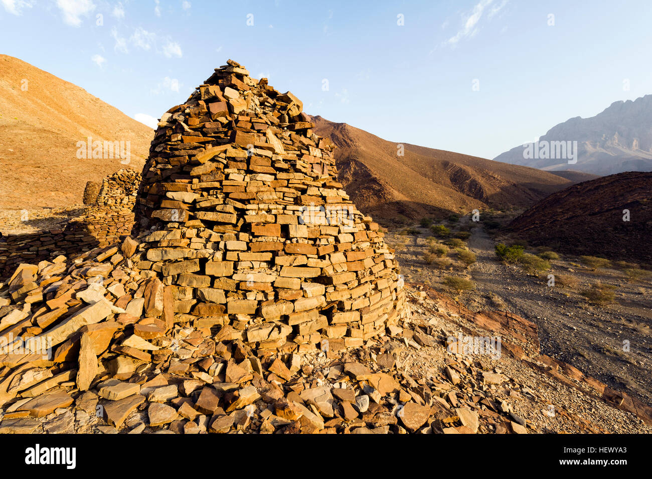 Ancient handmade stone burial mounds and tombs atop a desert ridge ...