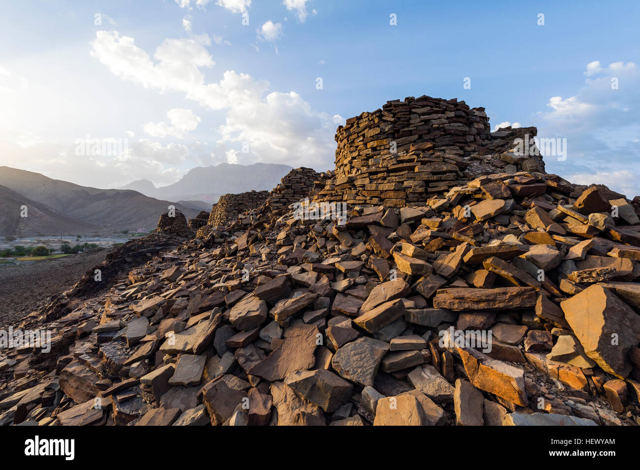 Ancient handmade stone burial mounds and tombs atop a desert ridge ...