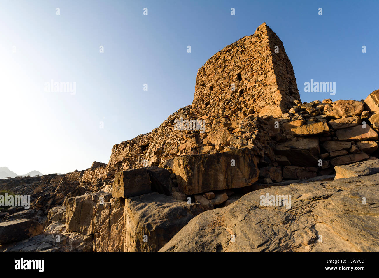 An ancient handmade stone watchtower in an abandoned mountain desert ...