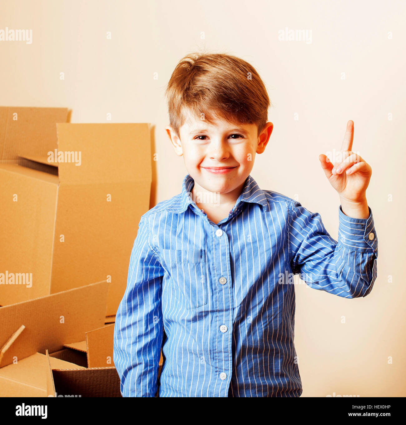 little cute boy in empty room, remoove to new house. home alone Stock ...