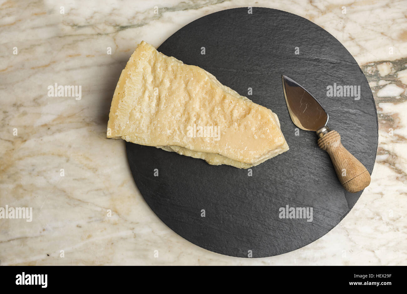 A parmesan piece overhead close up shot Stock Photo - Alamy