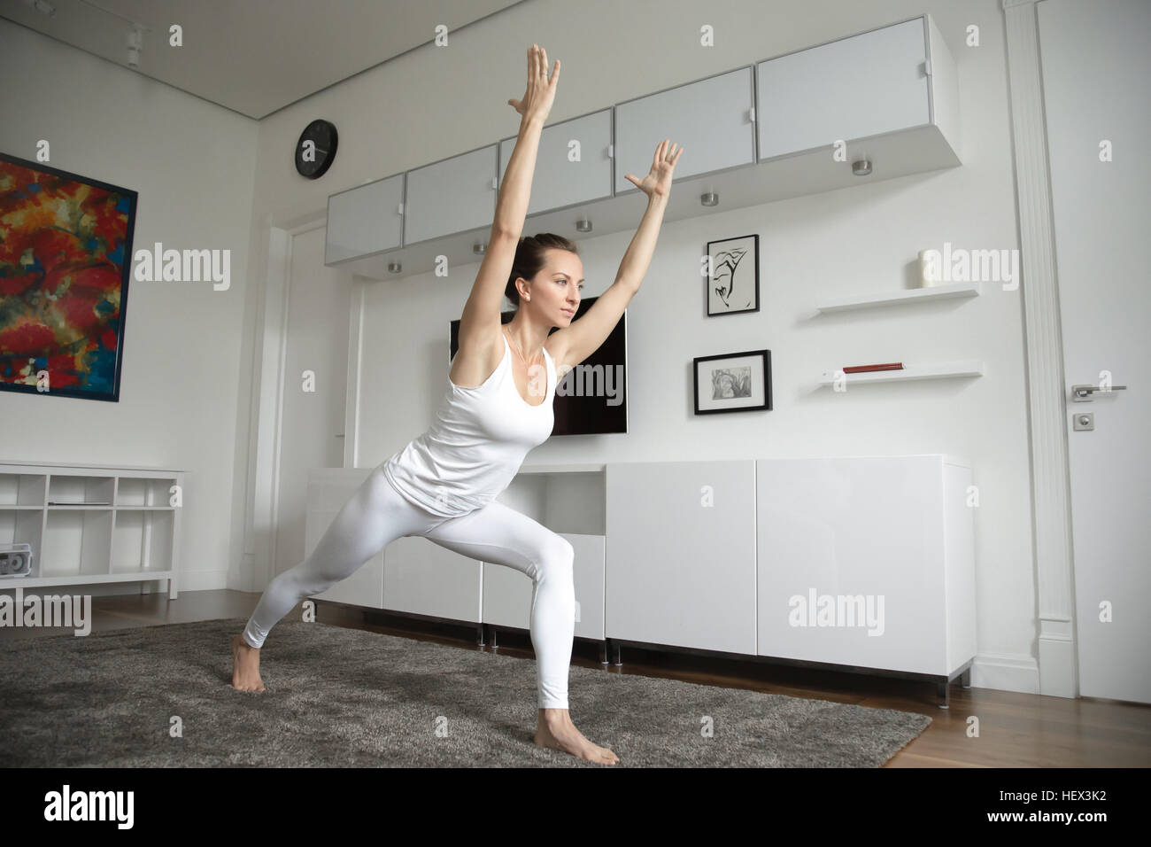 Warrior one exercise Stock Photo - Alamy