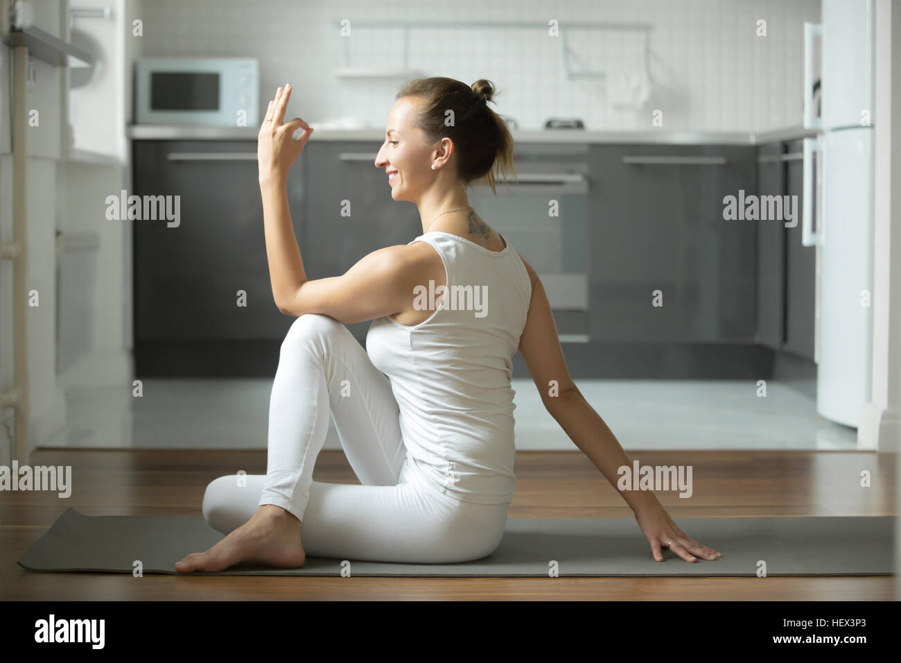 Ardha Matsyendrasana pose Stock Photo - Alamy
