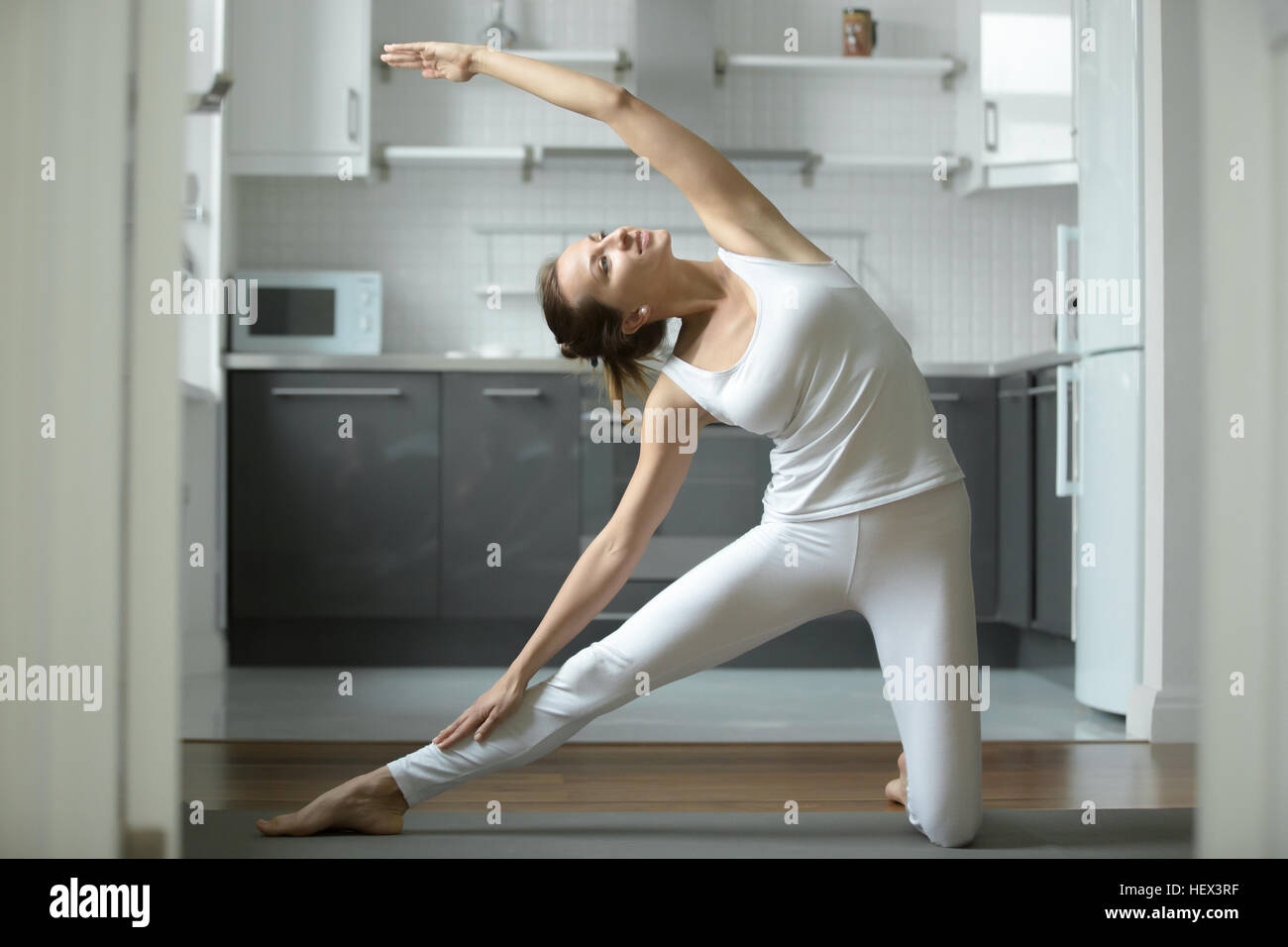 Woman stretching in Gate exercise Stock Photo - Alamy