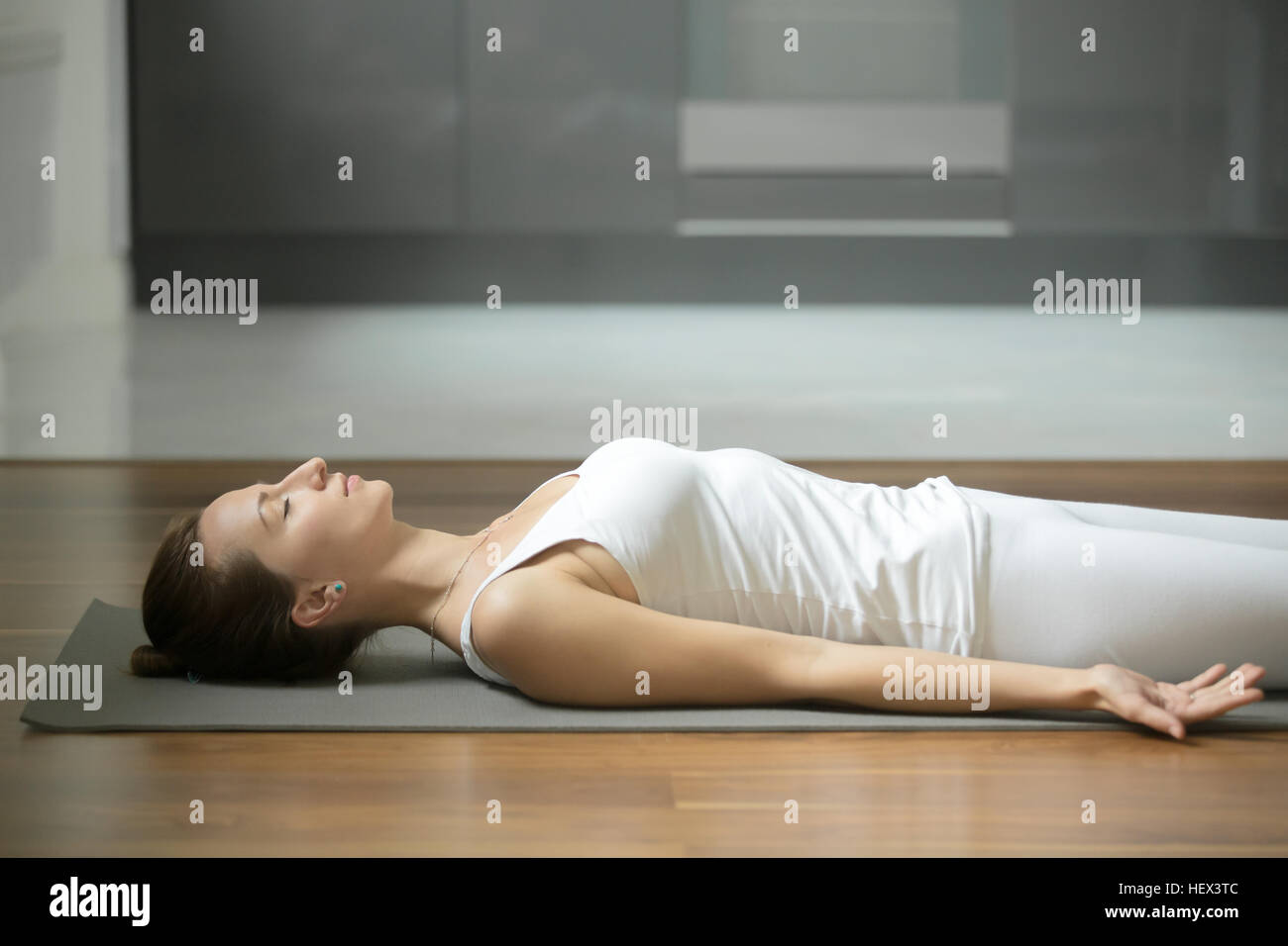 Woman lying in Corpse exercise Stock Photo - Alamy