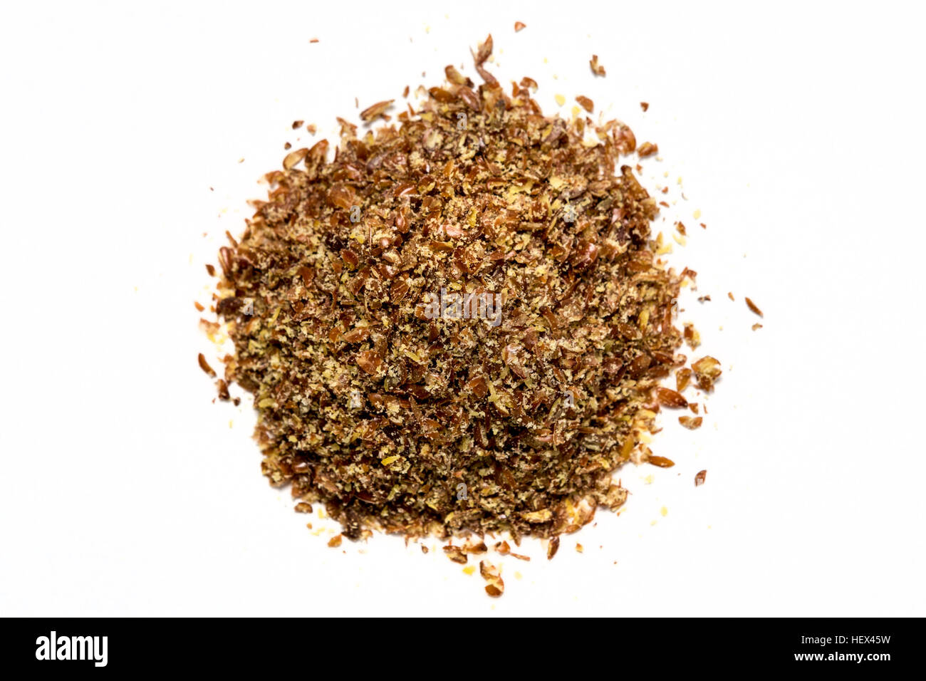 Ground flax meal isolated on white background Stock Photo - Alamy
